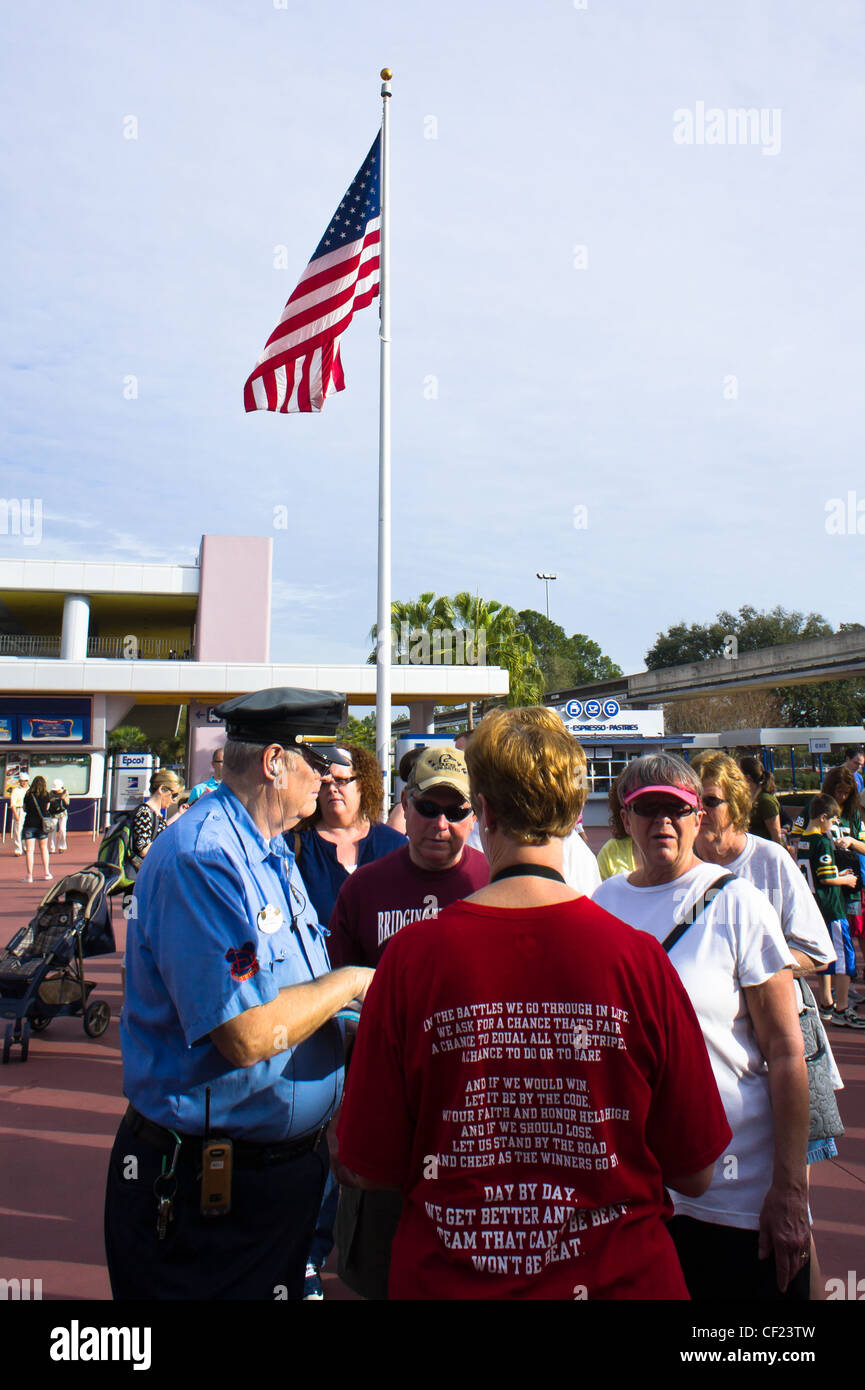 A uniformed security guard at Epcot park, Disney World, Florida gives ...