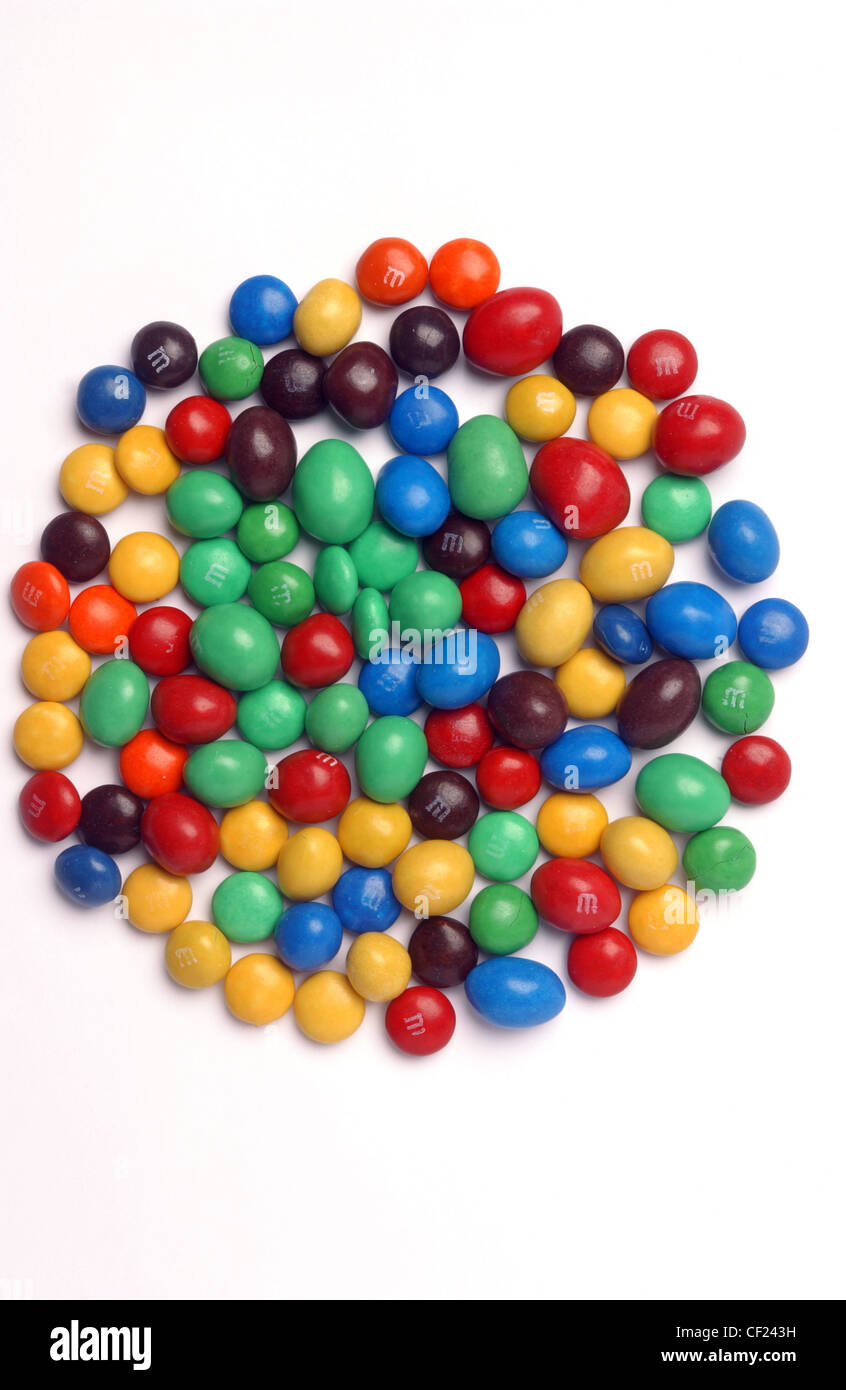 Different coloured M&Ms arranged in the shape of a circle Stock Photo ...