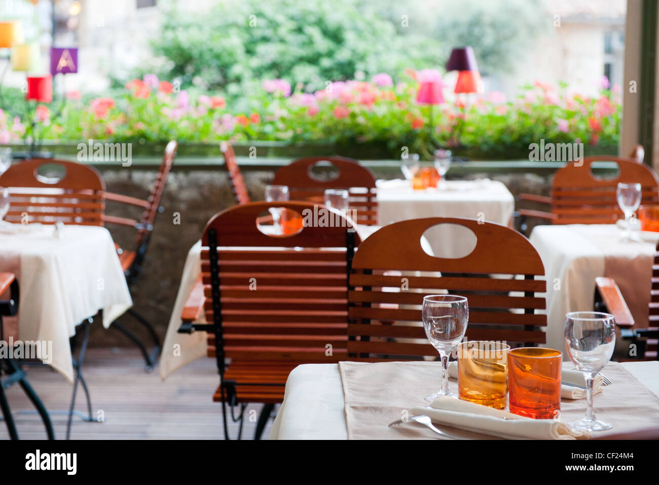 Colorful terrace outdoor with tables and chairs Stock Photo - Alamy