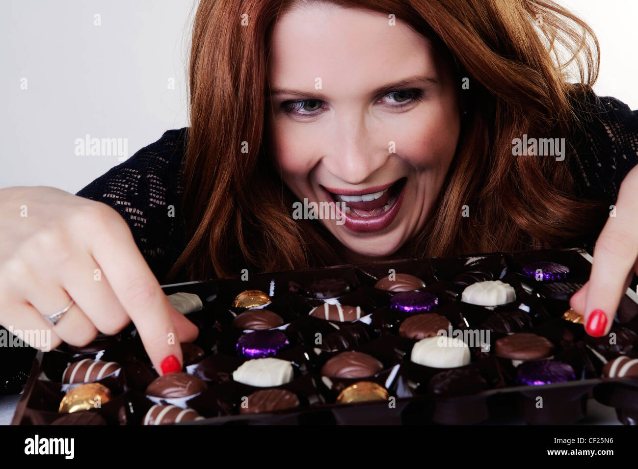 Woman holding large box chocolates hi-res stock photography and images ...