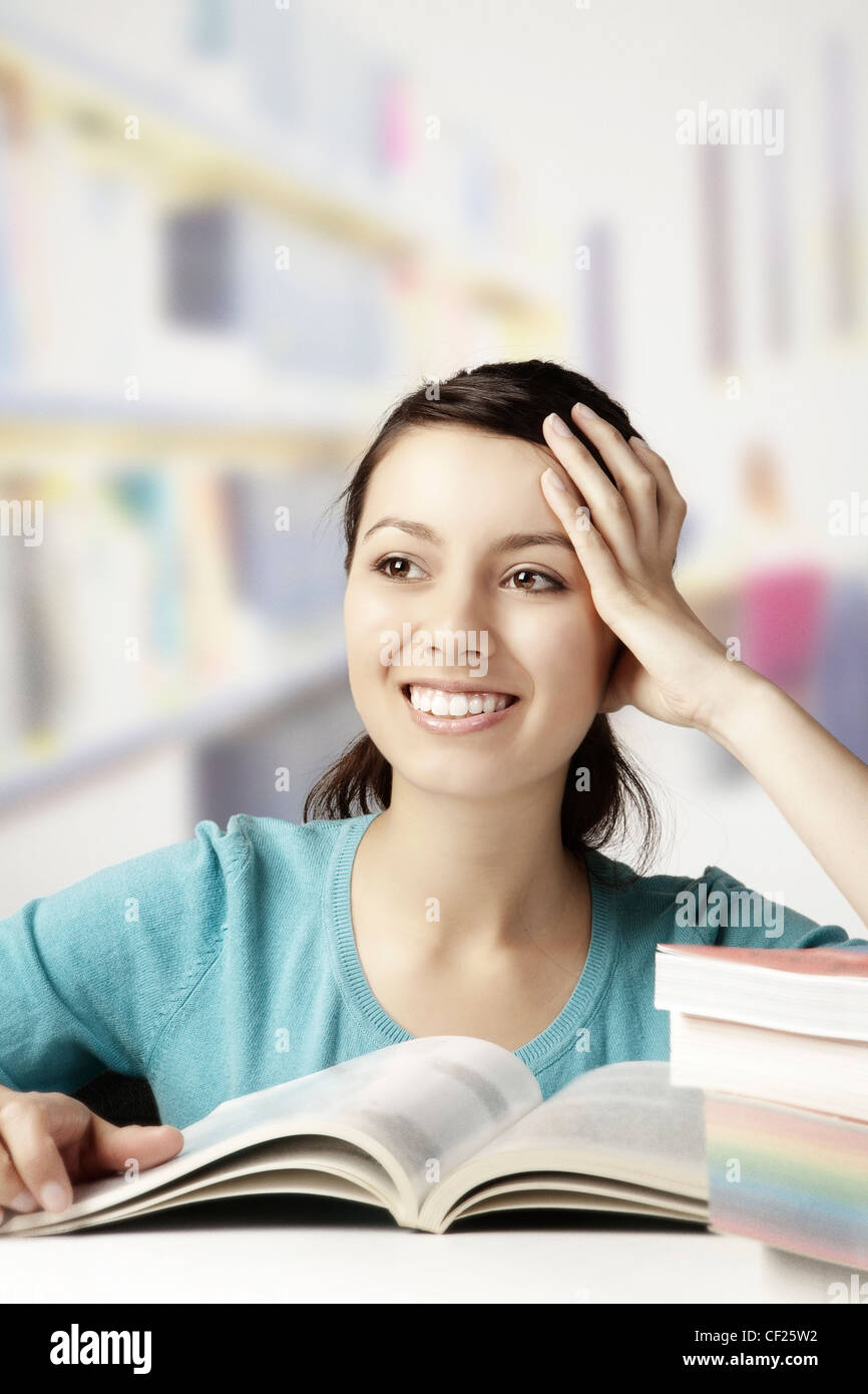 young girl happily doing her work Stock Photo - Alamy