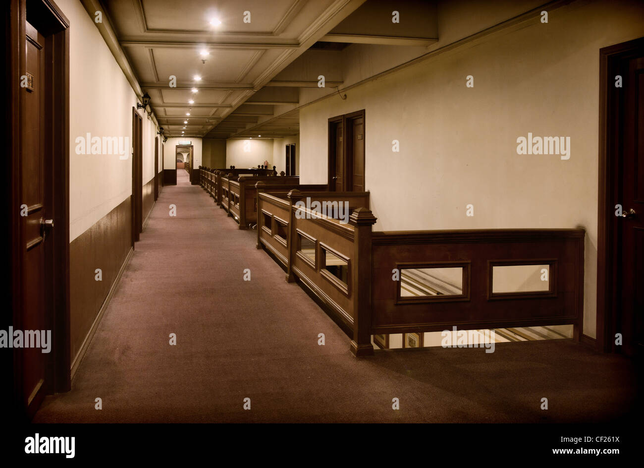 hallway with rooms inside a rough old hotel Stock Photo - Alamy