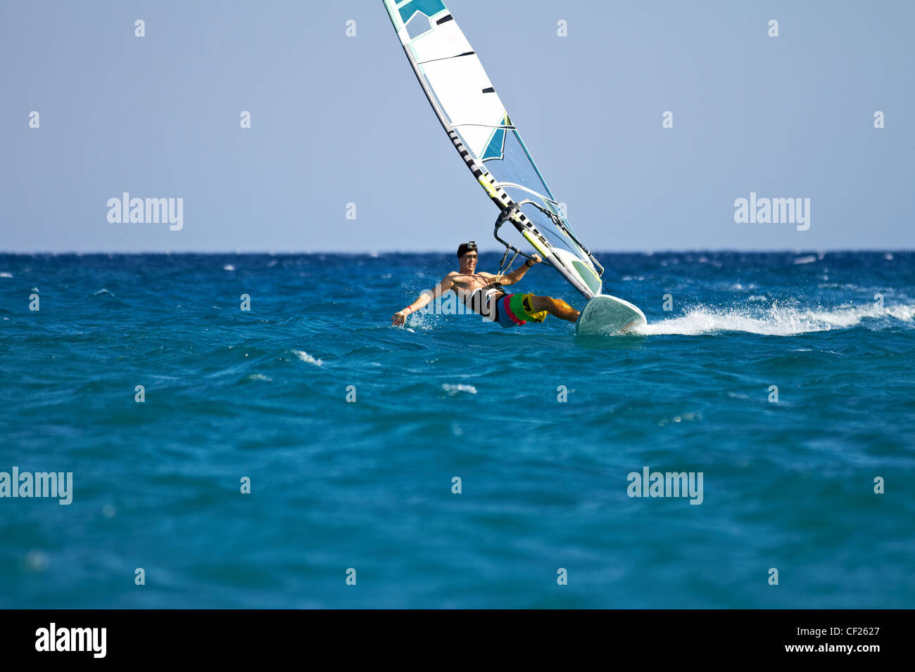 Front view of a windsurfer passing by almost horizontally Stock Photo ...