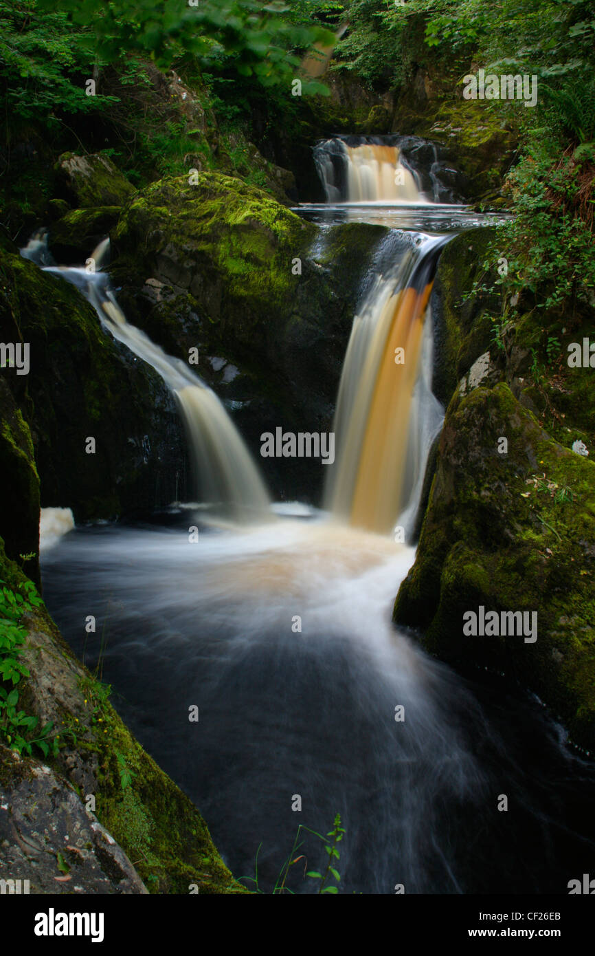The fast flowing Pecca twin falls running through woodland near ...