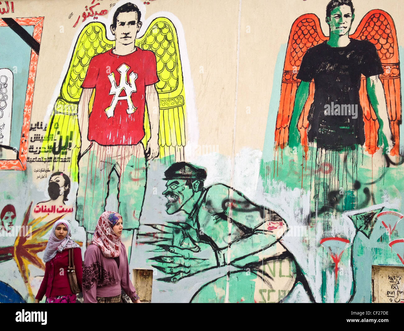 Women in front of a mural of the deceased Ultras of port Sad , on ...