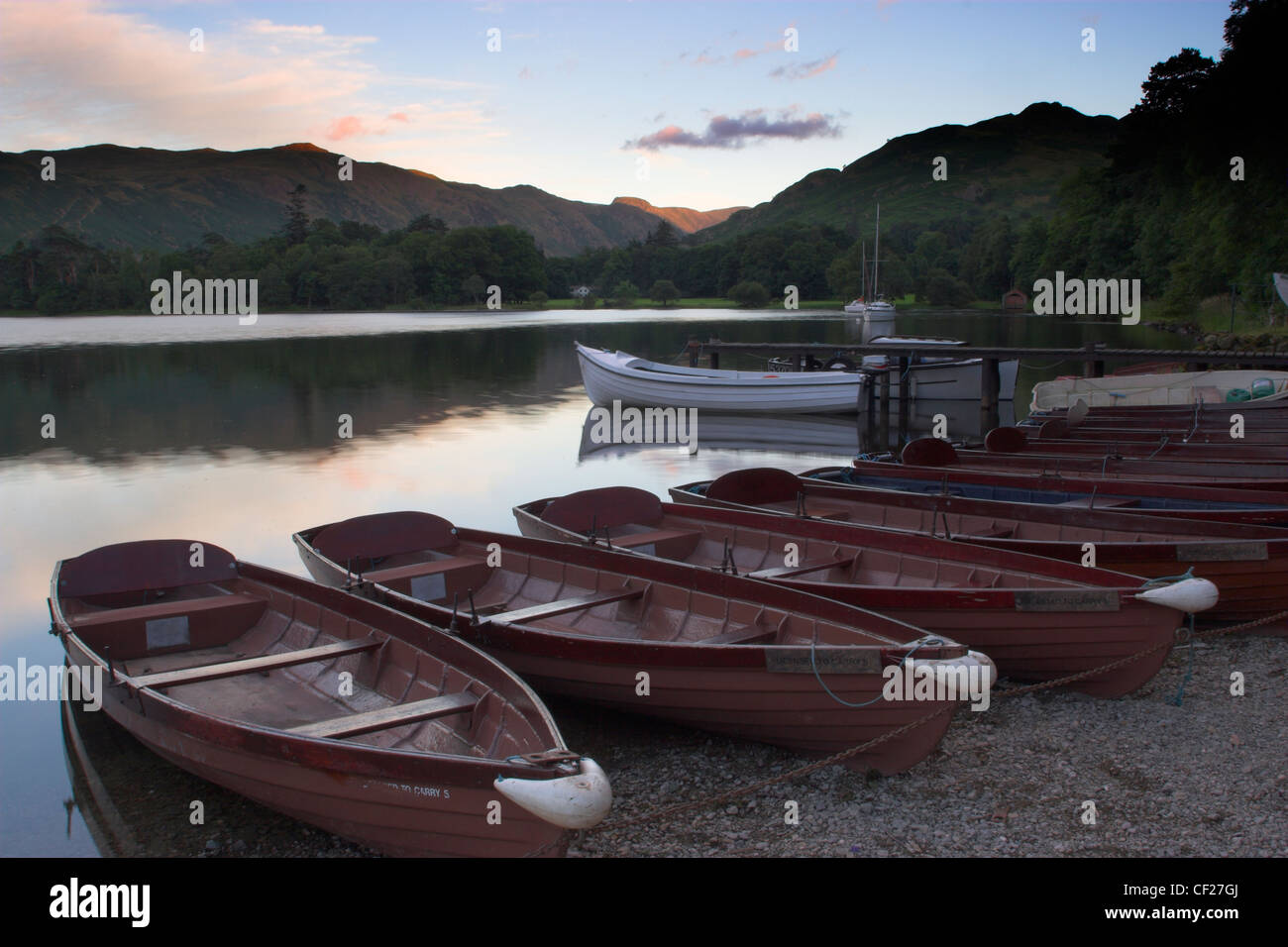Rowing boats and the sweeping vista of Ullswater which is part of the ...