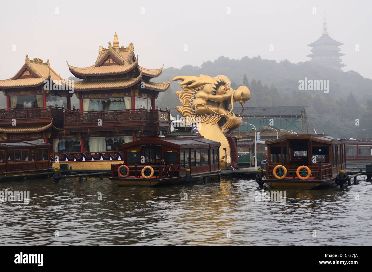 Golden Dragon Boat at West Lake Pleasure boat dock and Leifeng Pagoda ...