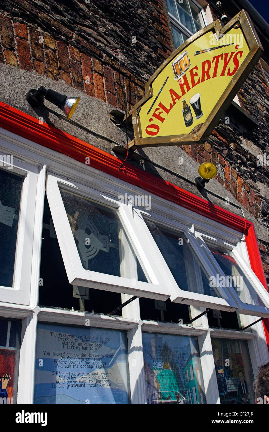 A traditional public house sign and frontage in the town of Dingle ...