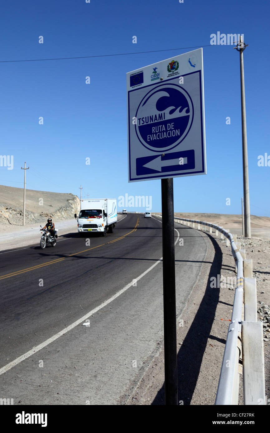 Tsunami evacuation route sign in Spanish language on road near Ilo ...