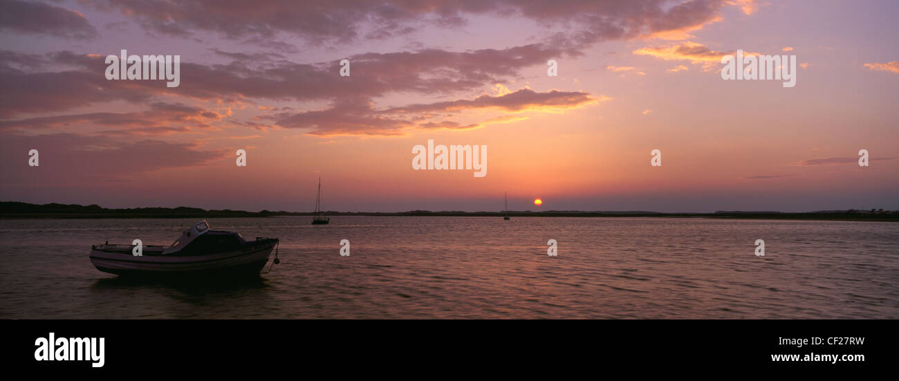A colourful sunset near the coastal town of Ravenglass which is the ...