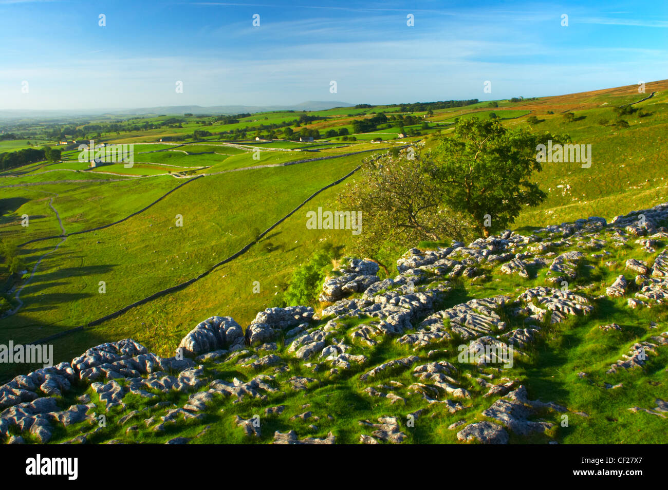 The natural rock formations of limestone paving above Malham Cove in ...