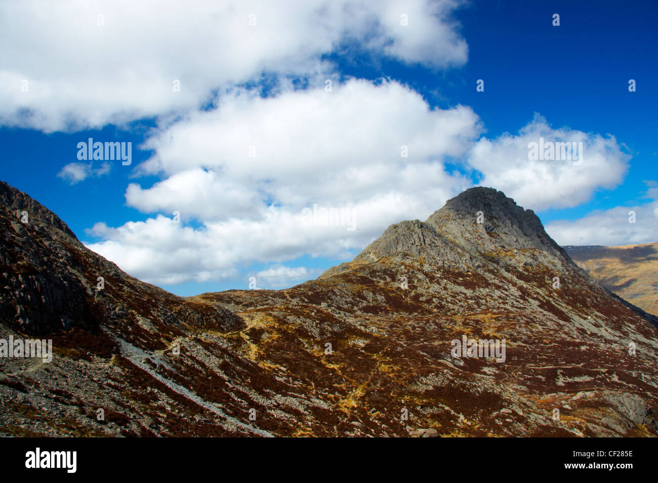The dramatic landscape surrounding the mountain peak of Tryfan Stock ...