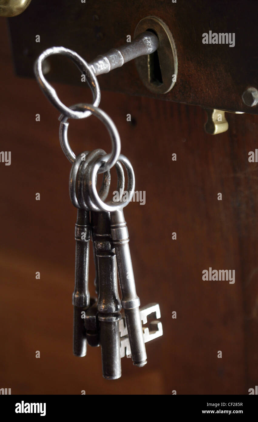 Old bunch of keys hanging from lock Stock Photo - Alamy