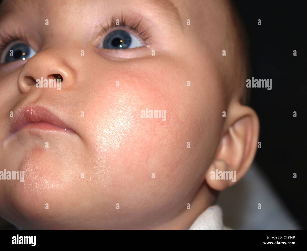 Male baby looking up Stock Photo - Alamy