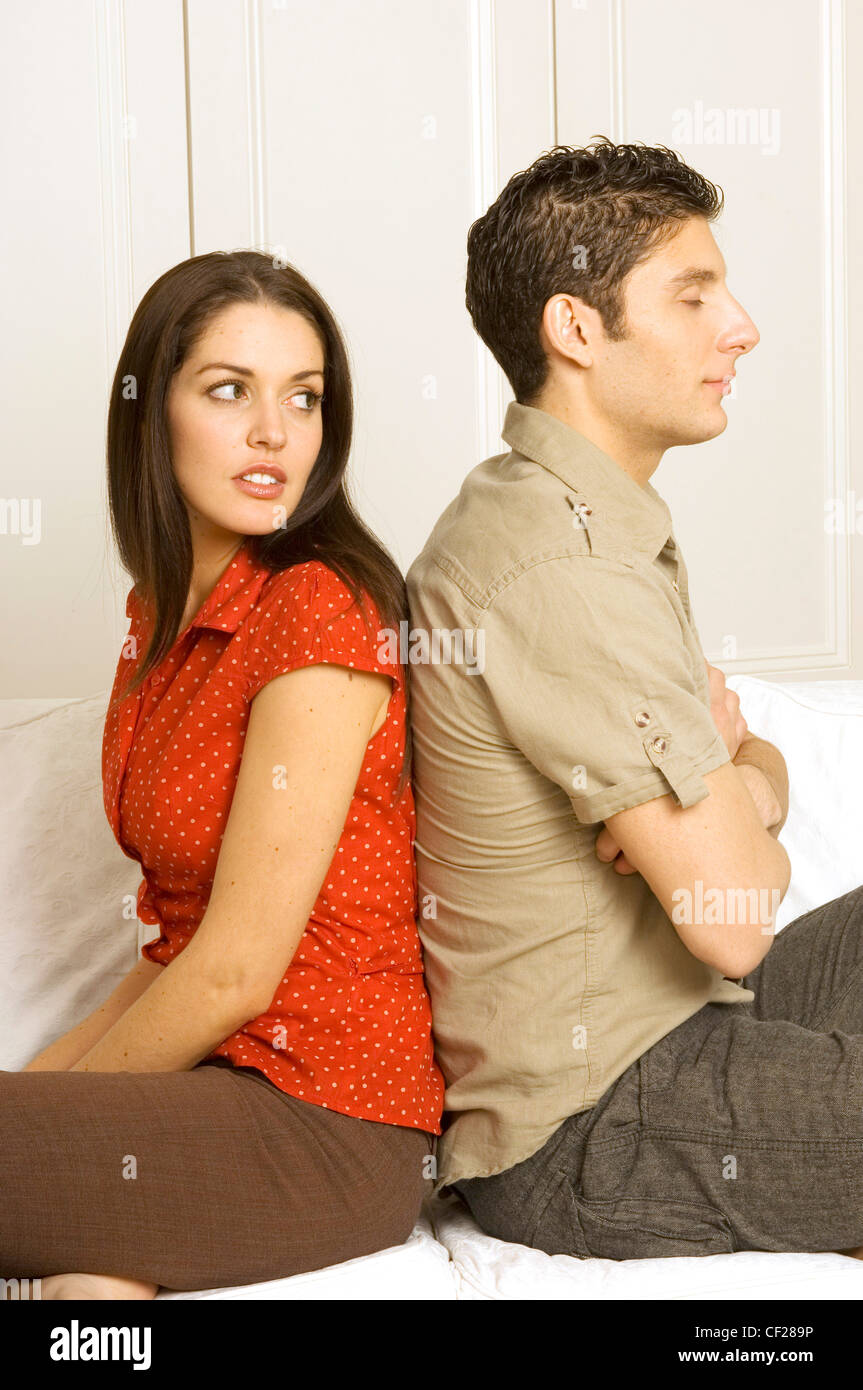 Couple sitting with backs together: CAMERA PRESS Stock Photo - Alamy