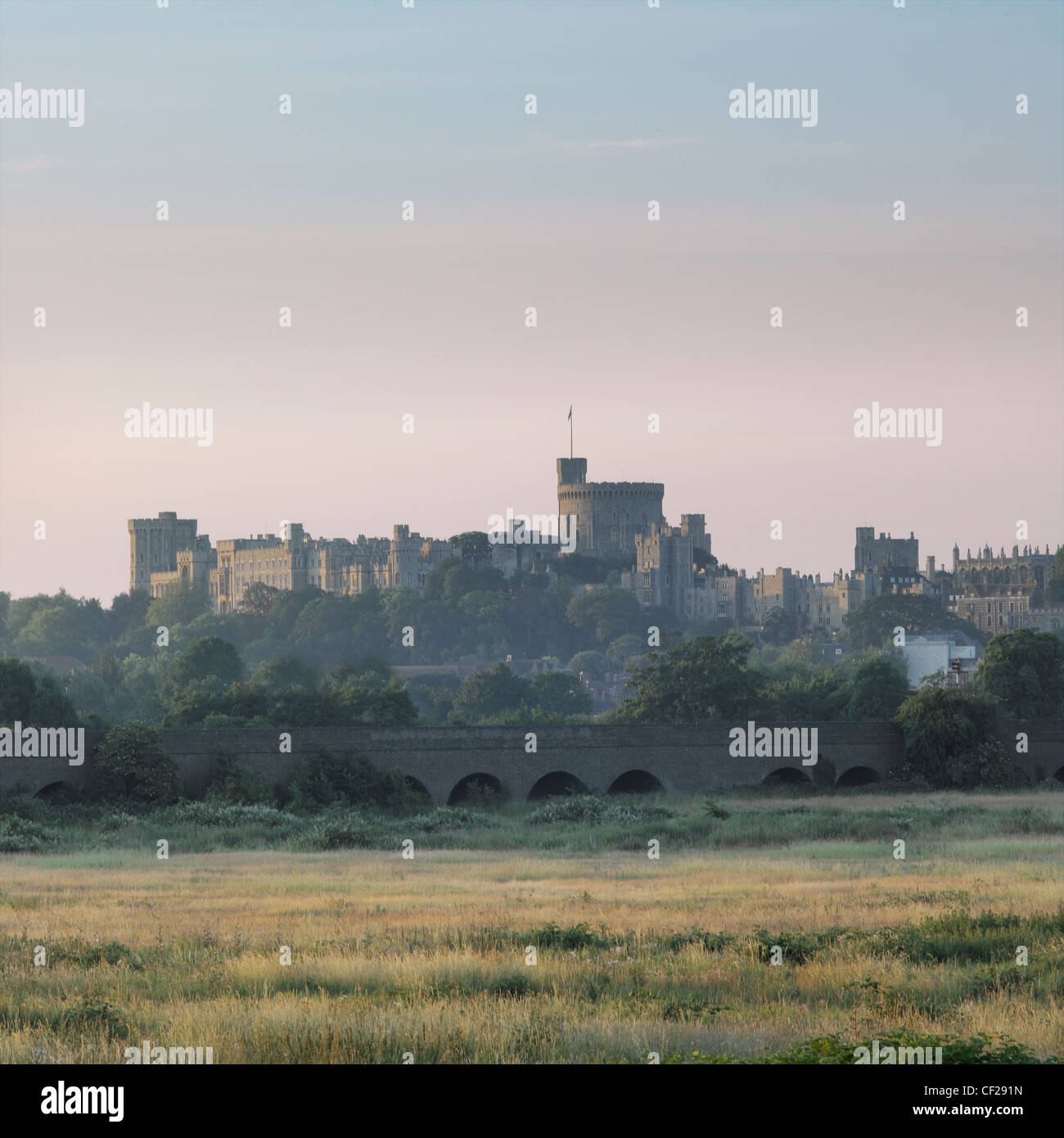 Windsor Castle at dawn. Windsor Castle is the largest inhabited castle ...
