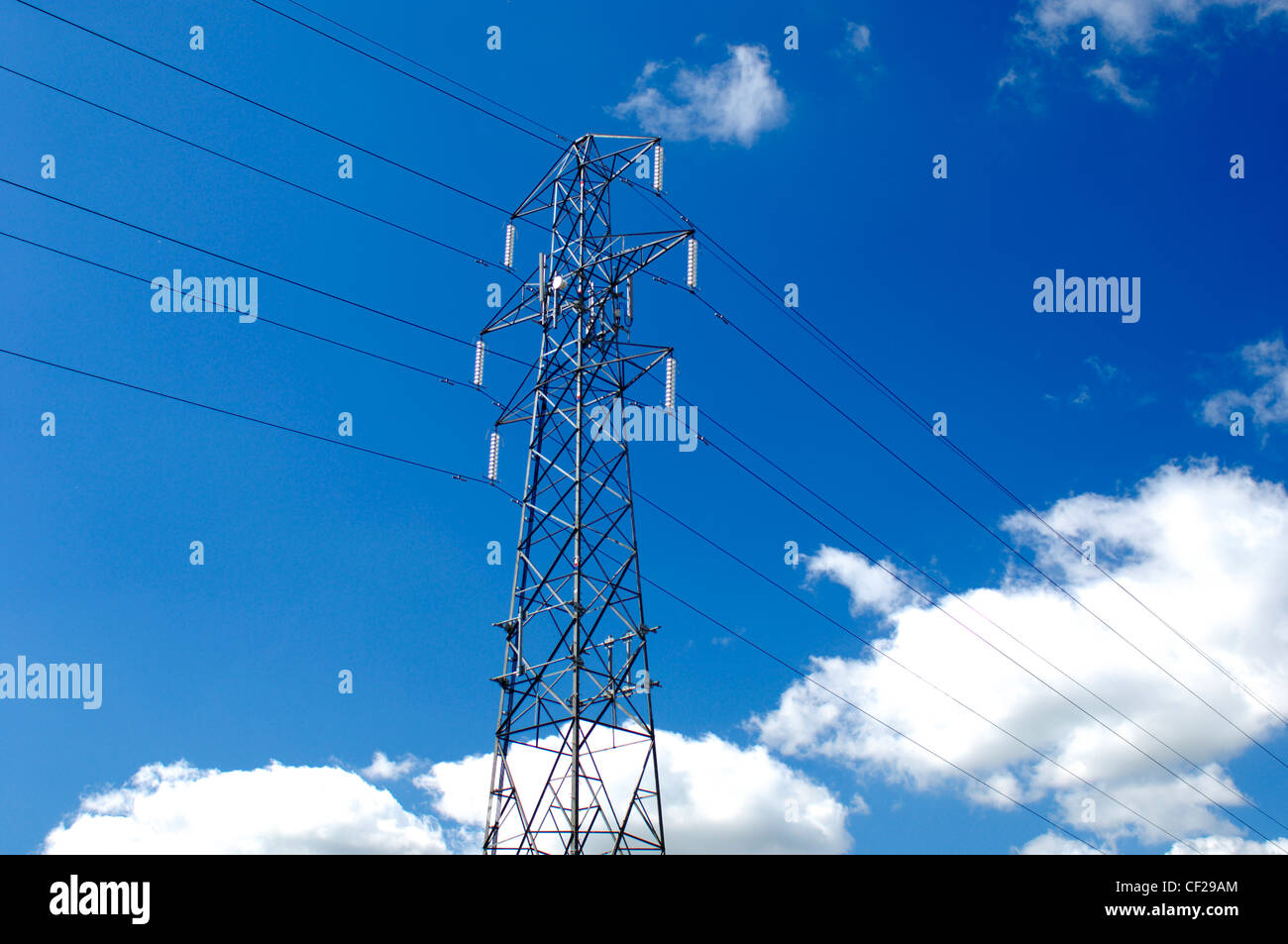 Electricity pylon with clouds and blue sky. Pylons can be made from a ...