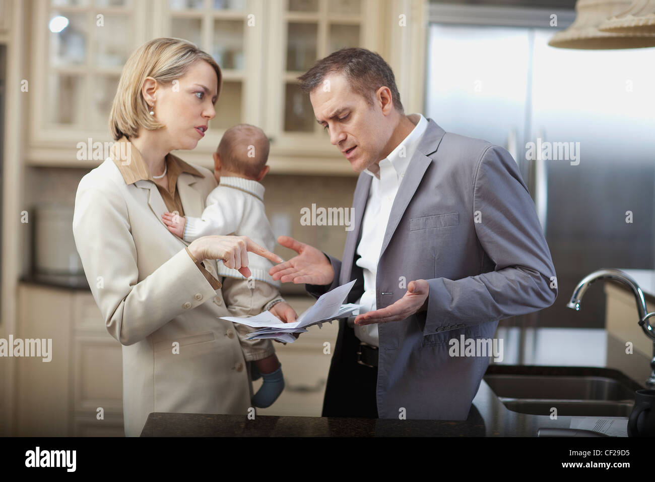 Husband And Wife With Baby Stressing Over Household Bills; Jordan ...