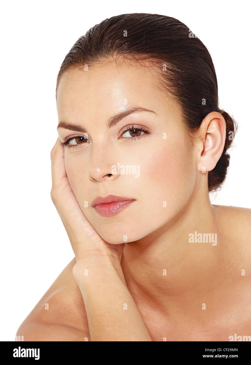 Female with hand resting on cheek Stock Photo - Alamy