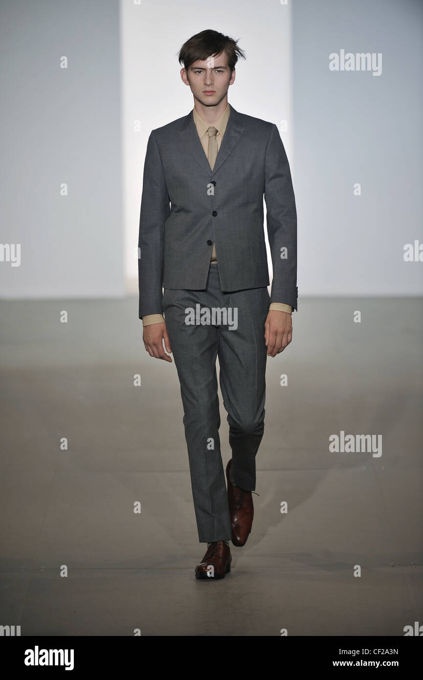 Marni Milan Ready to Wear Spring Summer Model wearing a grey suit a ...