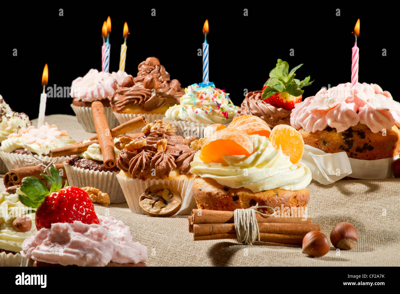 Muffins with cream, fruits and nuts Stock Photo - Alamy