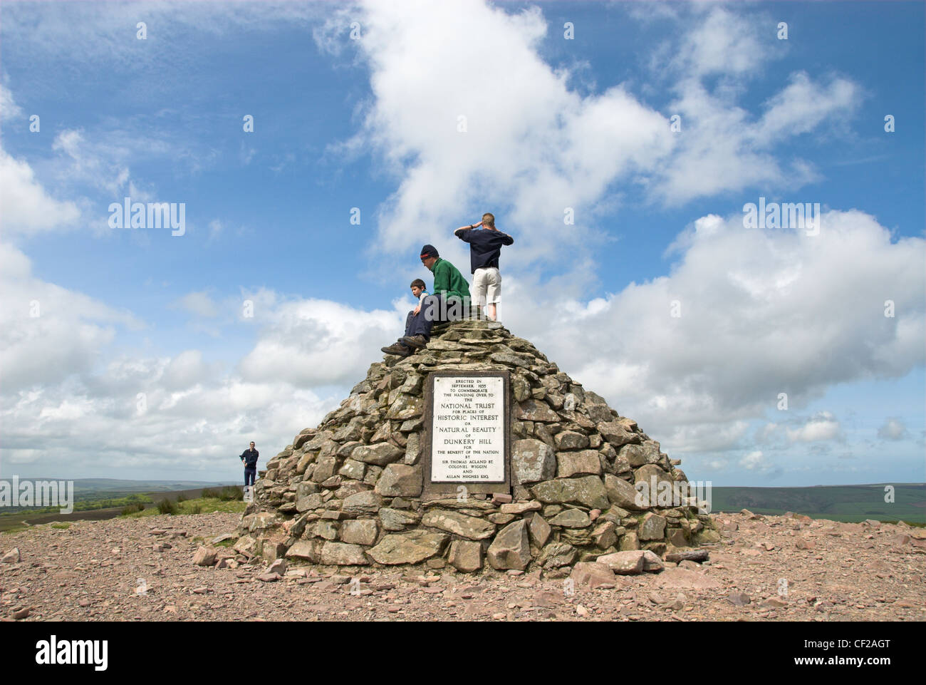 Teenage boys sitting on top of Dunkery Beacon, the summit of Dunkery ...