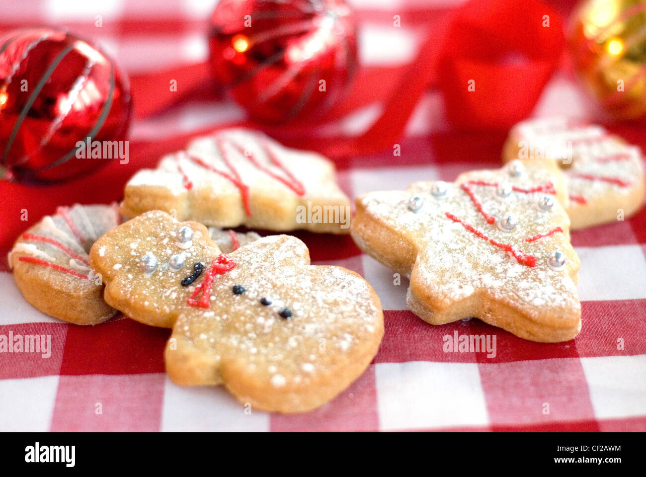 A plate of festive christmas biscuits in the shape of candy canes ...