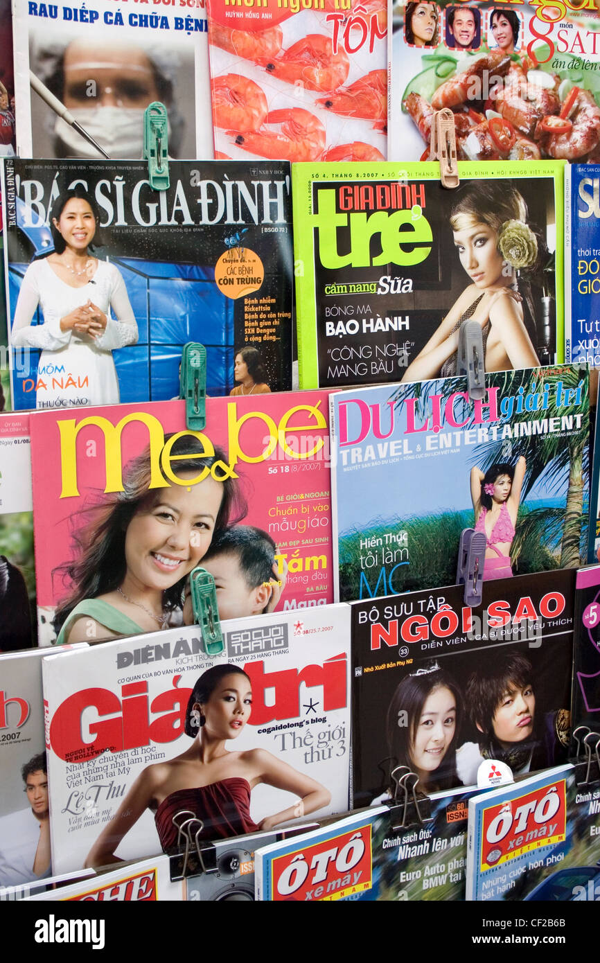 Colorful Vietnamese magazines are for sale at a news stand in Saigon ...