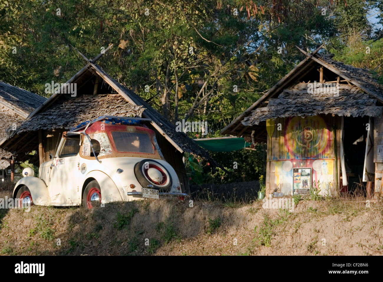 An antique British sports car is parked in the countryside in rural Pai ...