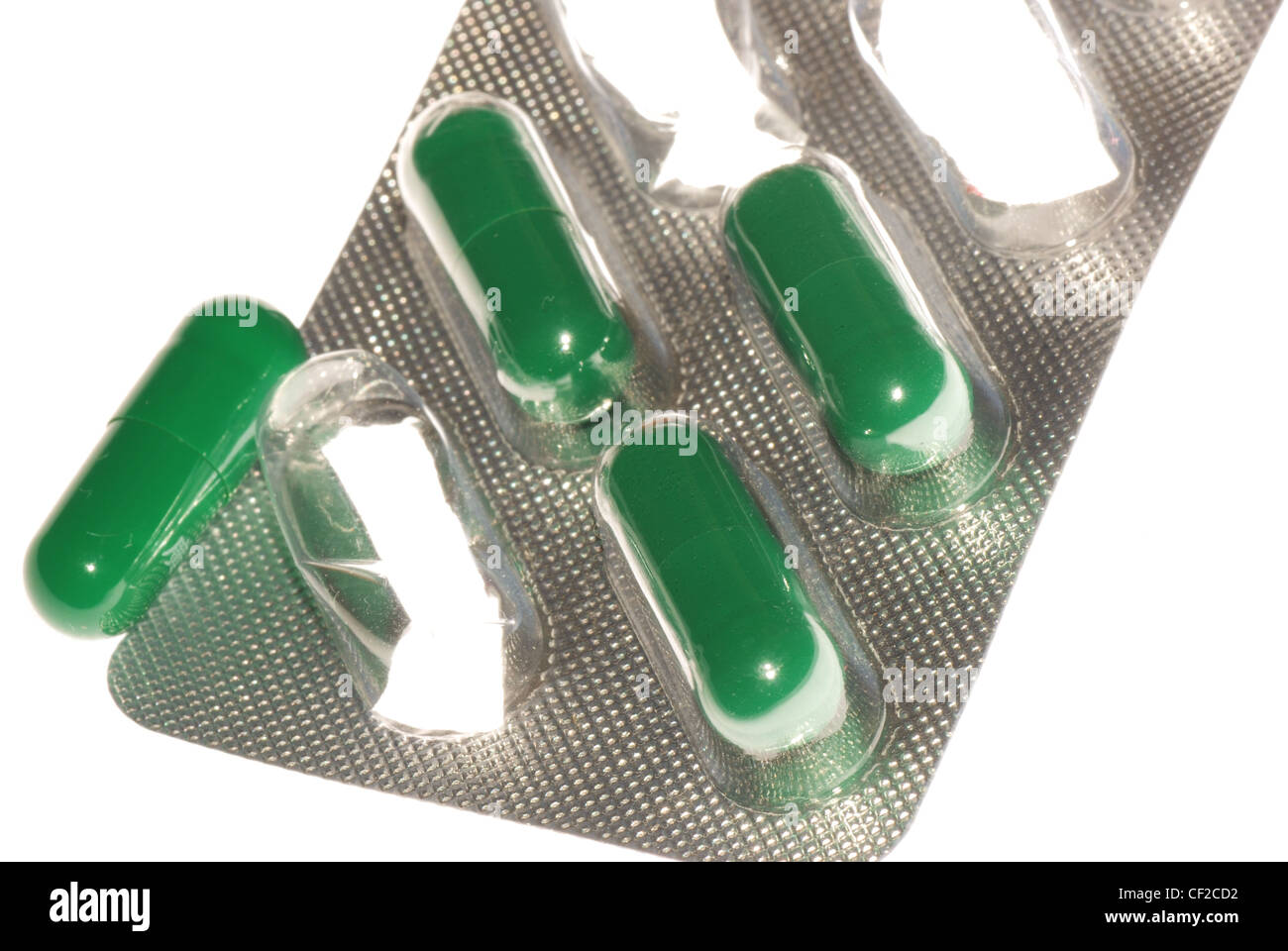 green capsule pill isolated on white Stock Photo - Alamy