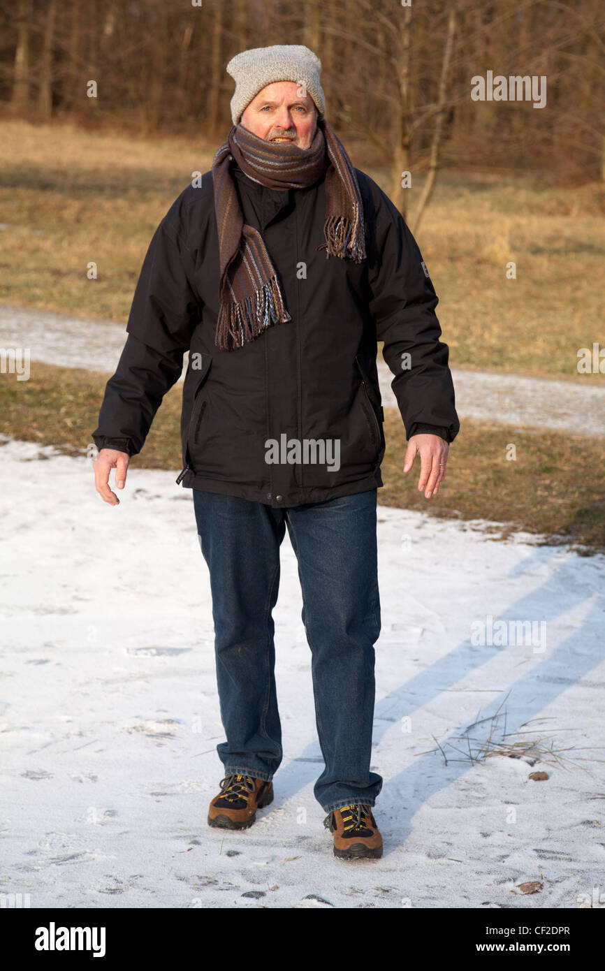 Elderly man is walking Stock Photo - Alamy