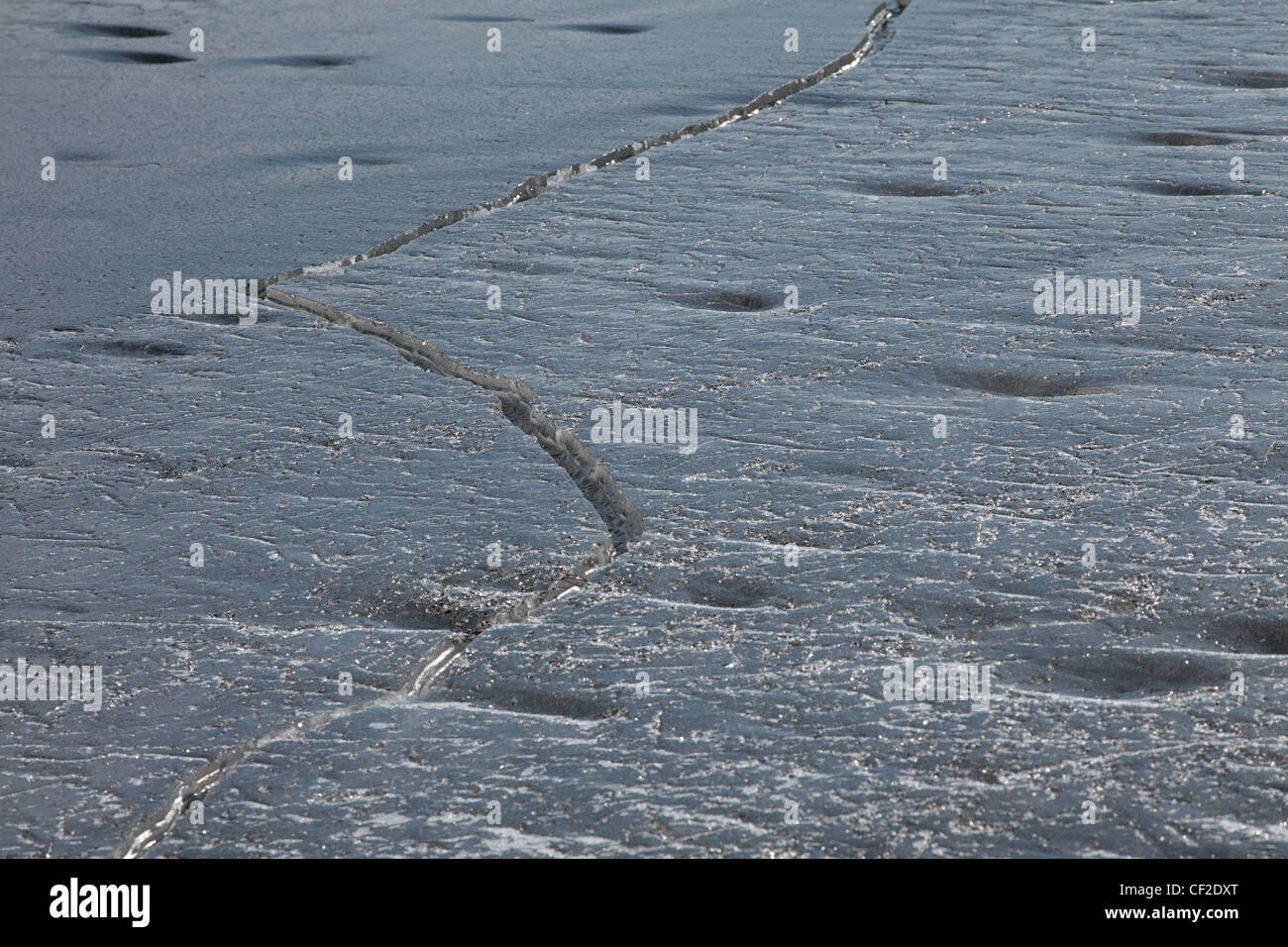 Ice cracking pond hi-res stock photography and images - Alamy