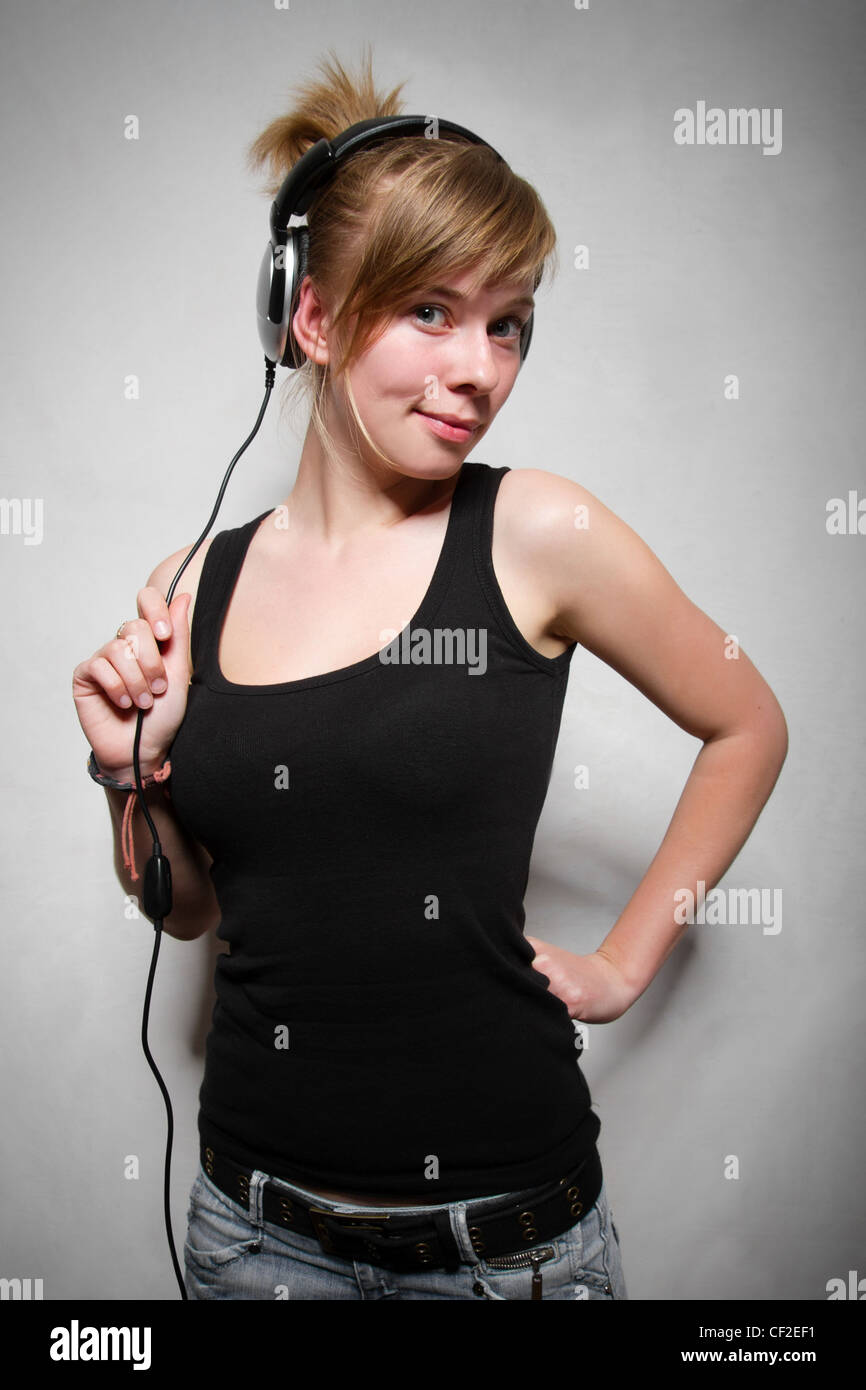 Late teen attractive chick posing with stereo headset on her head Stock ...