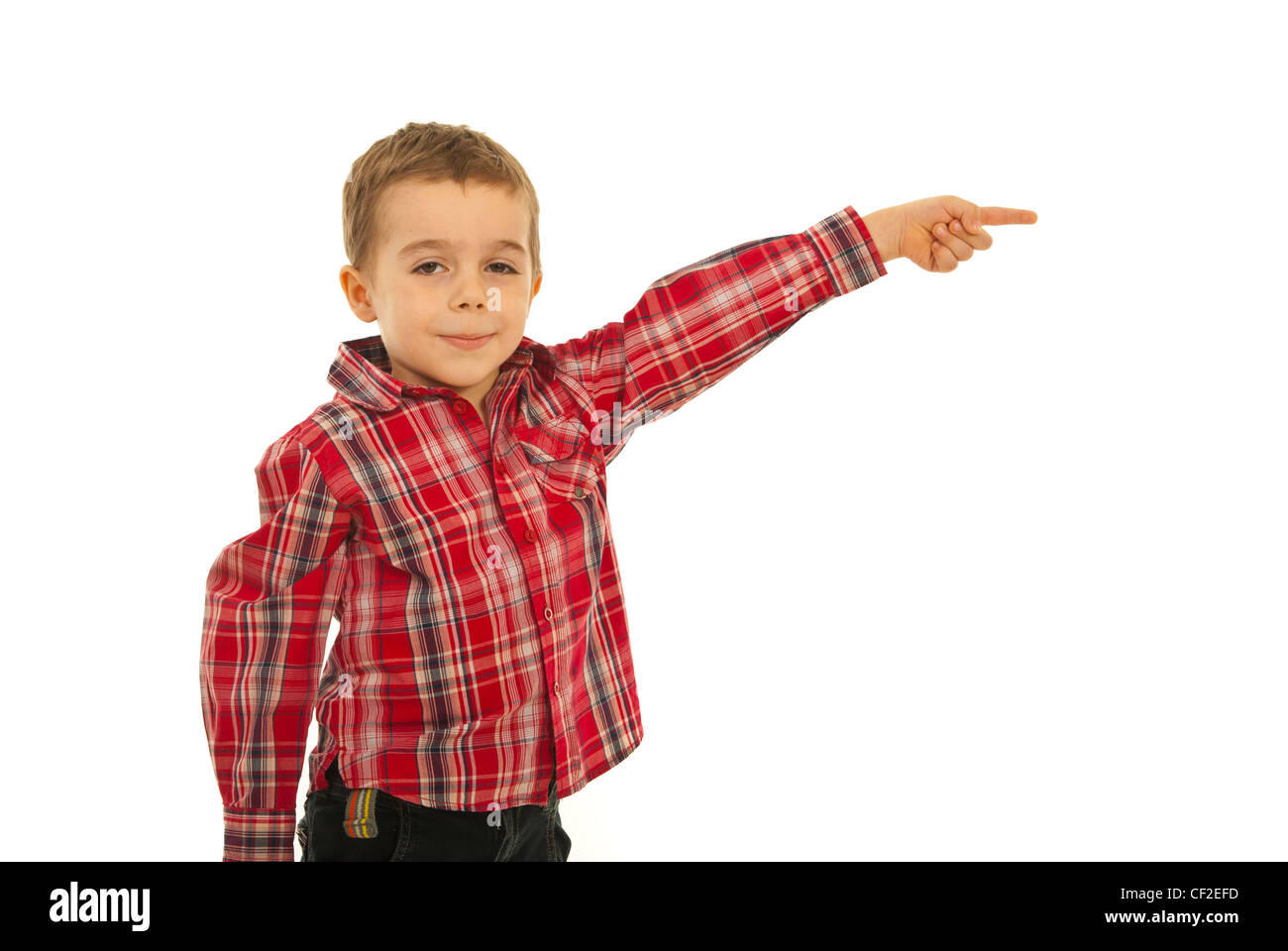 Happy kid boy pointing away to copy space isolated on white background ...