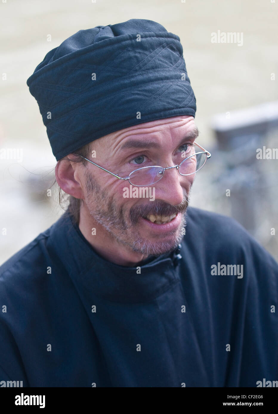 Portrait of Orthodox priest participates in the baptising ritual during ...