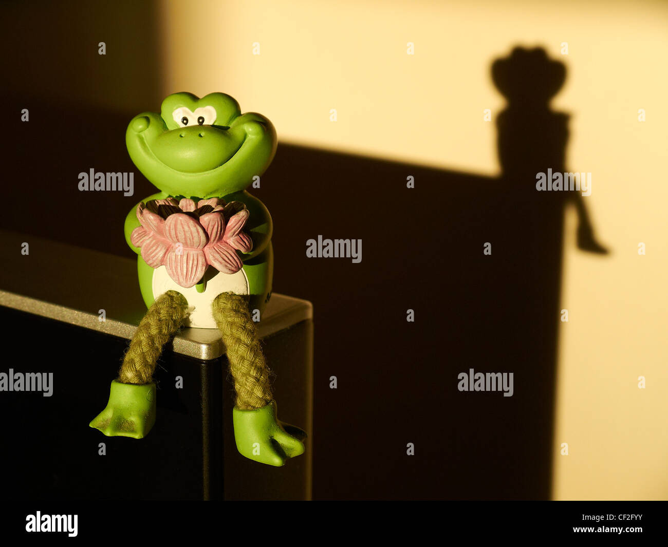 Happy smiling toy frog Stock Photo - Alamy