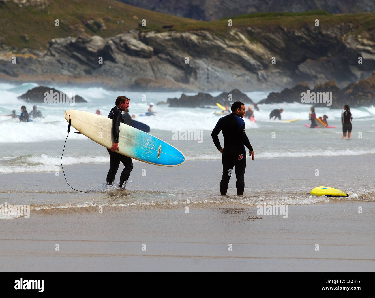 Surfers in the sea off the coast of Newquay Stock Photo - Alamy