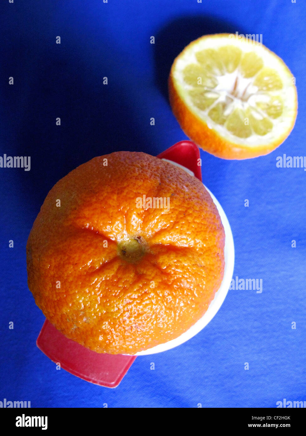 Plastic Orange Sqeezer Stock Photo - Alamy