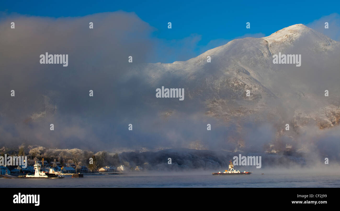 The Corran ferry port with hoarfrost covered woodland behind Stock ...