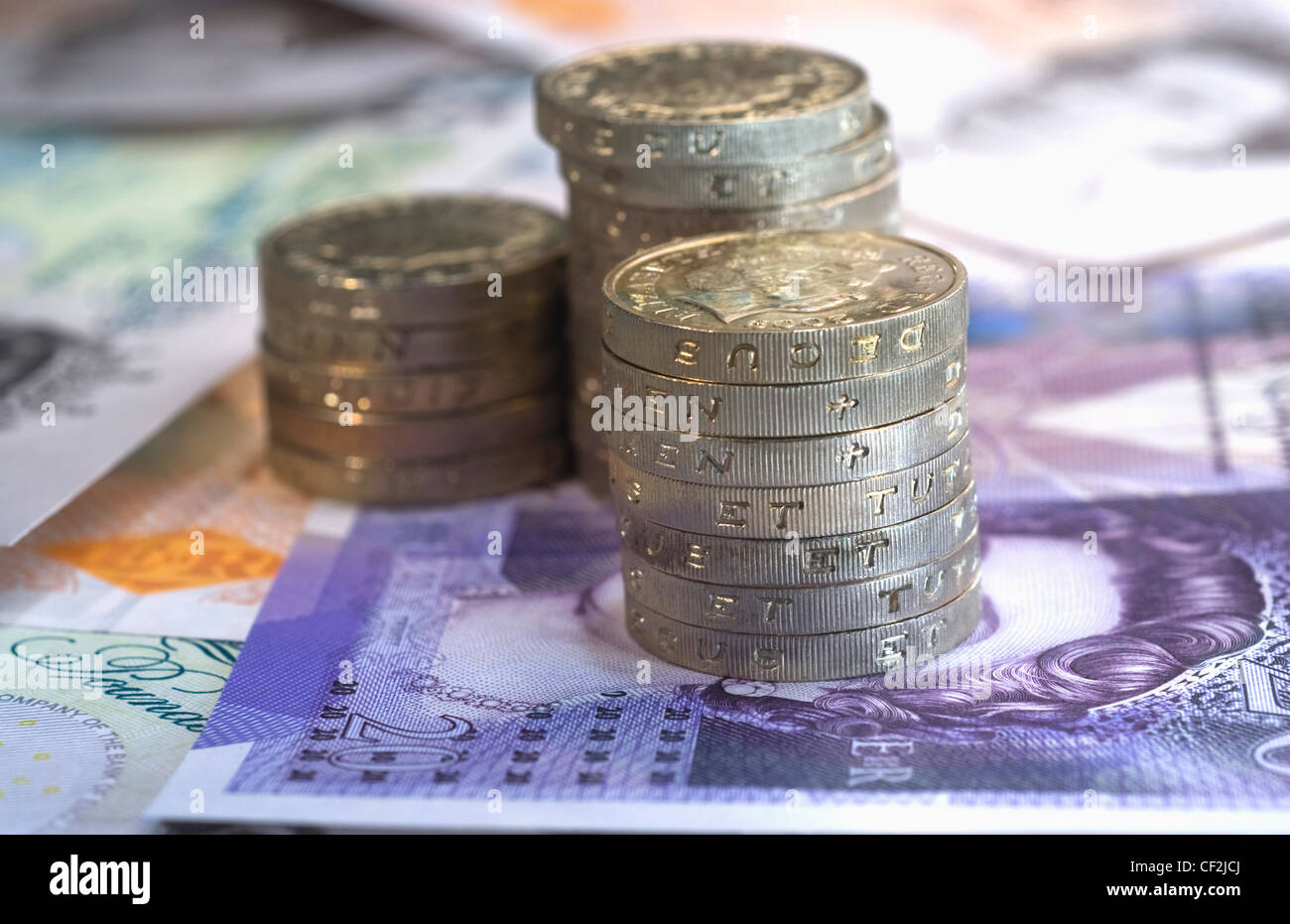 Pound notes and coins Stock Photo - Alamy