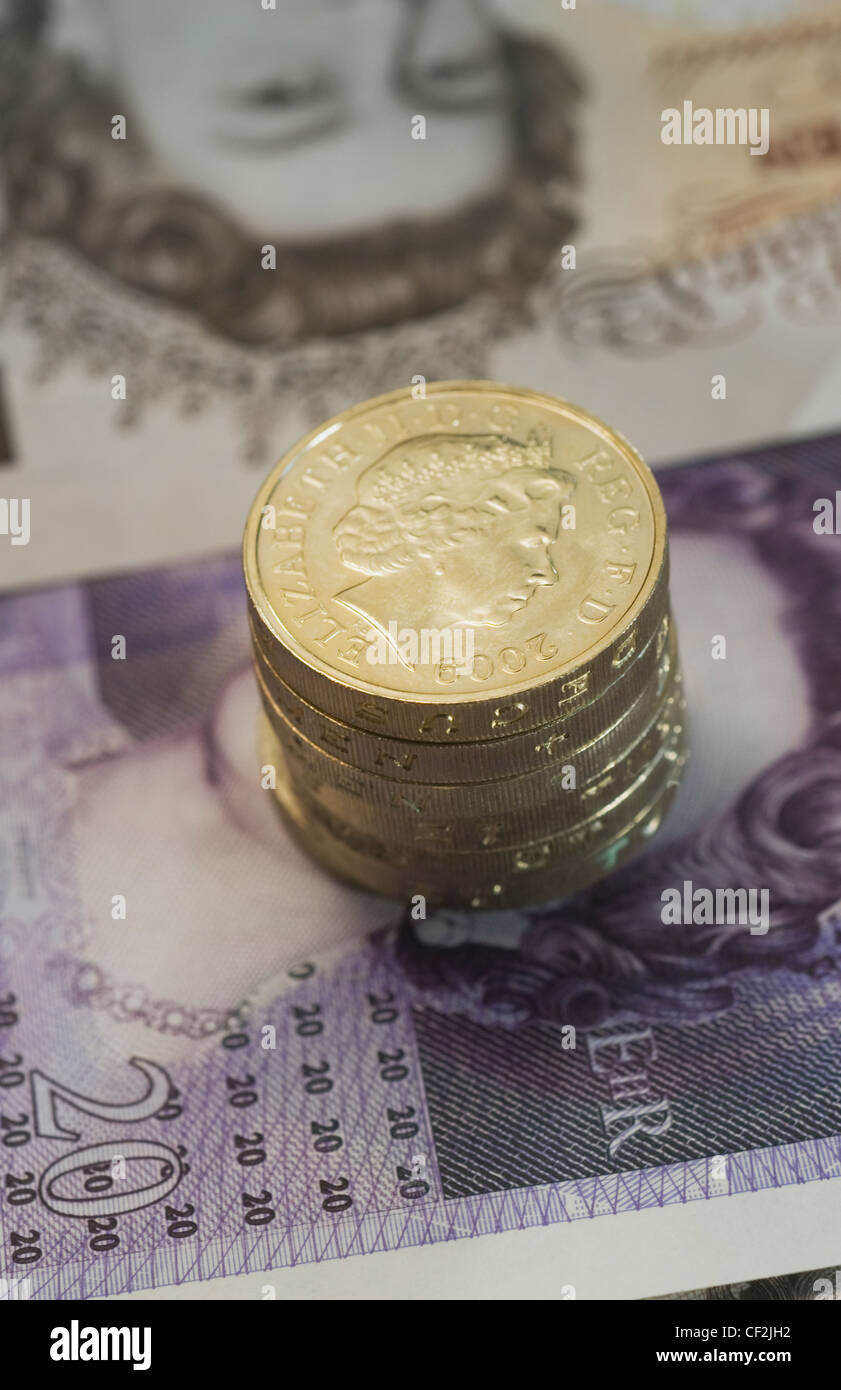 Pound notes and coins Stock Photo - Alamy