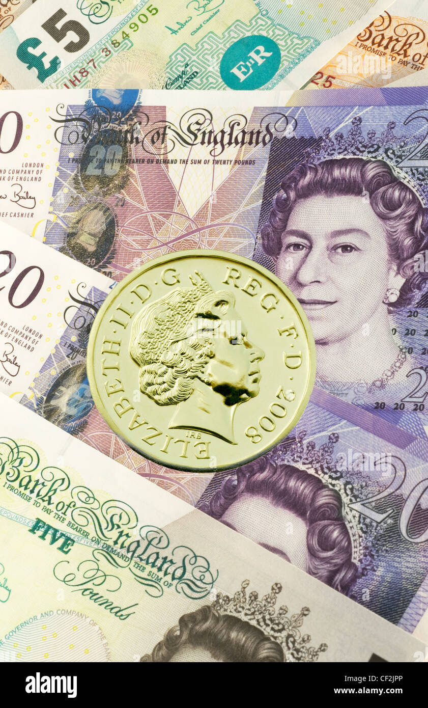 Pound notes and coins Stock Photo - Alamy