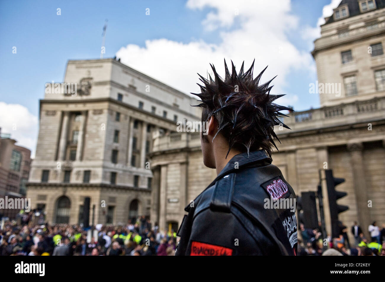 A protester with a punk hair style and wearing a leather jacket at the ...