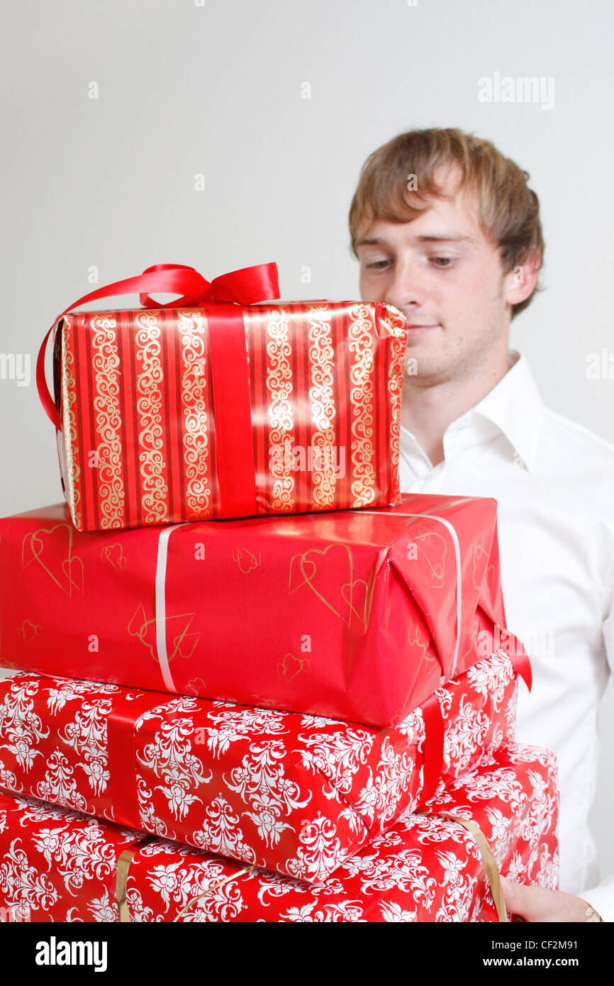 Man presenting several christmas hi-res stock photography and images ...