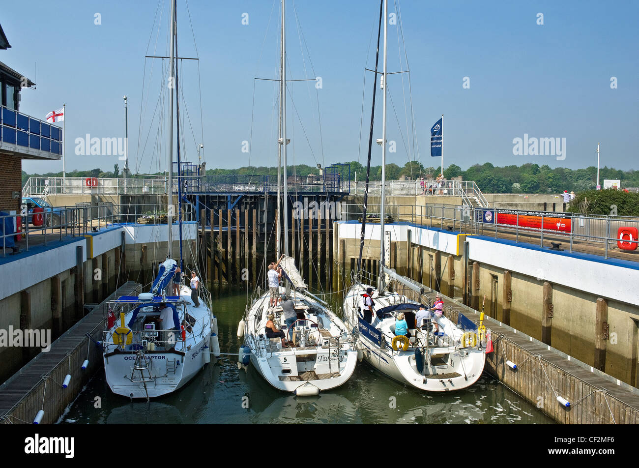 Three sailboats in the lock at Chatham Maritime Marina Stock Photo - Alamy