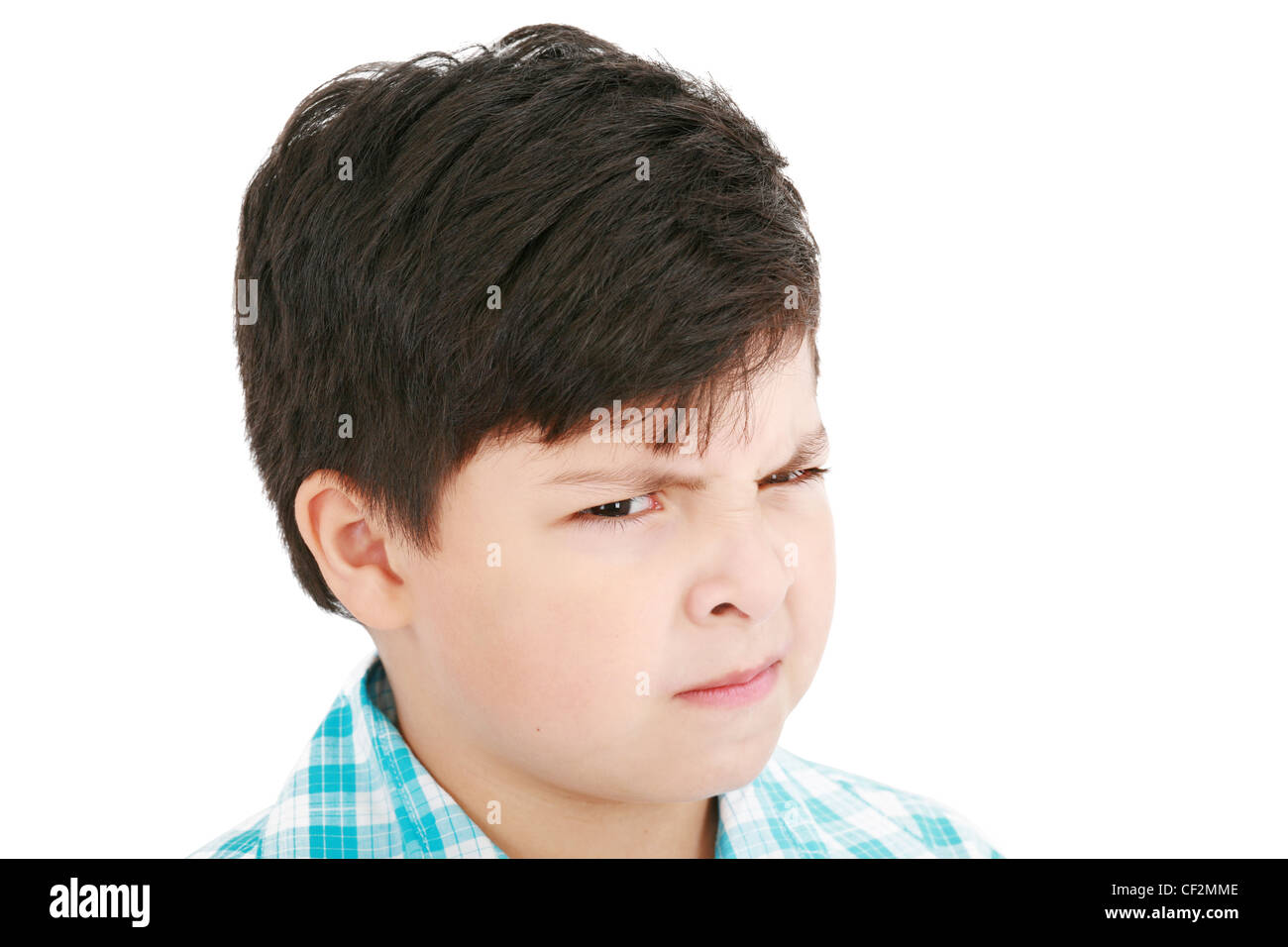 Close-up portrait of angry little boy isolated on white background ...