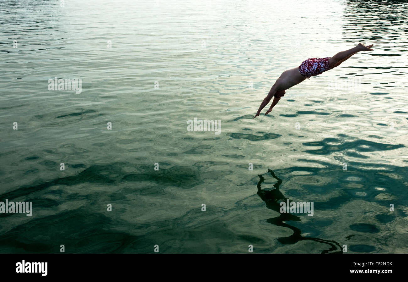 A man diving into water Stock Photo - Alamy