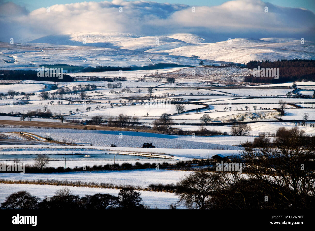 Farmland and the Cheviot hills covered by winter snow Stock Photo - Alamy