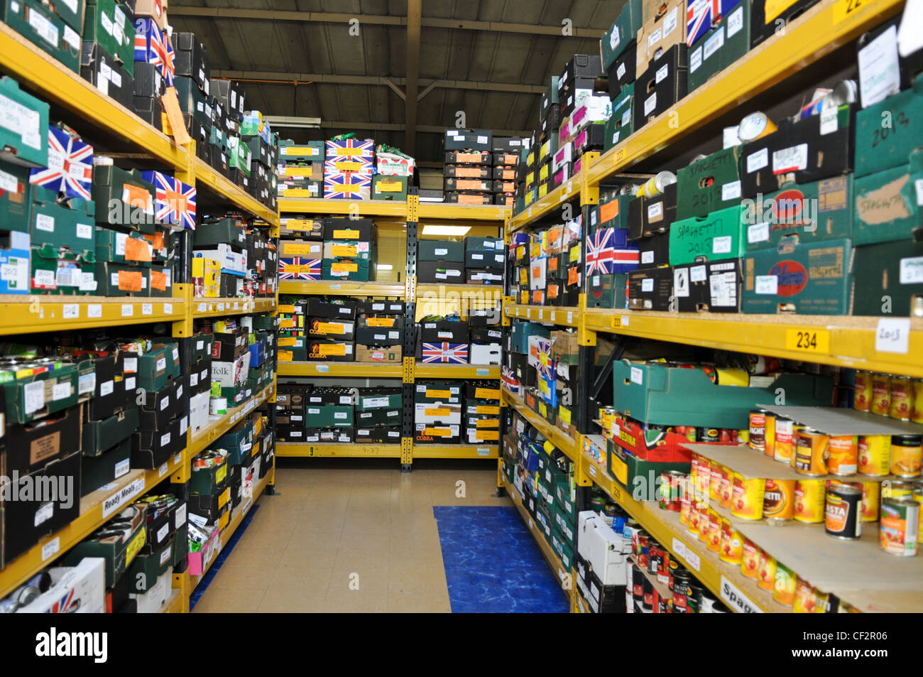 View of stocked shelves at a food bank in a West Midlands warehouse ...