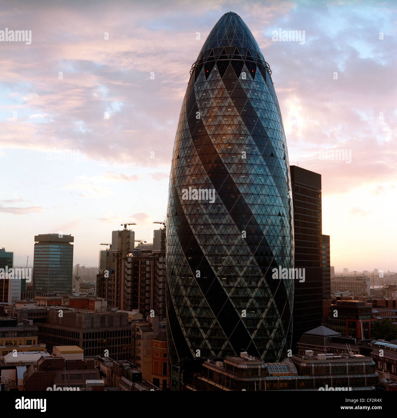 The Gherkin building at dusk Stock Photo - Alamy